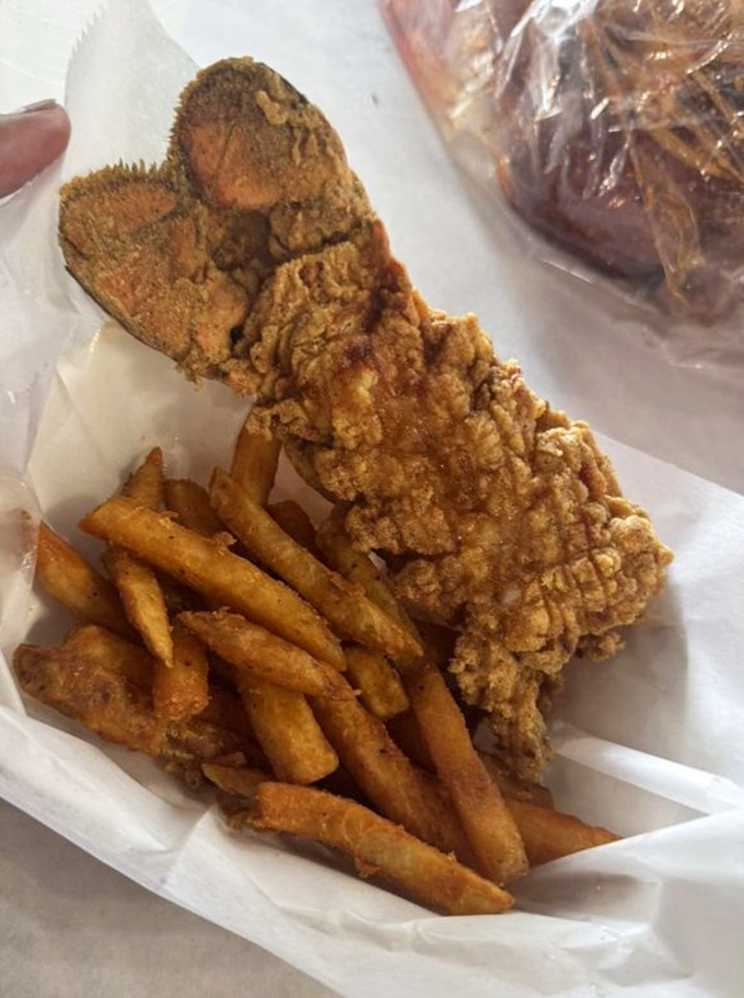 Golden-fried lobster tail meets seasoned fries. This isn't just lunch; it's edible architecture that crumbles with satisfying crispness at first bite.