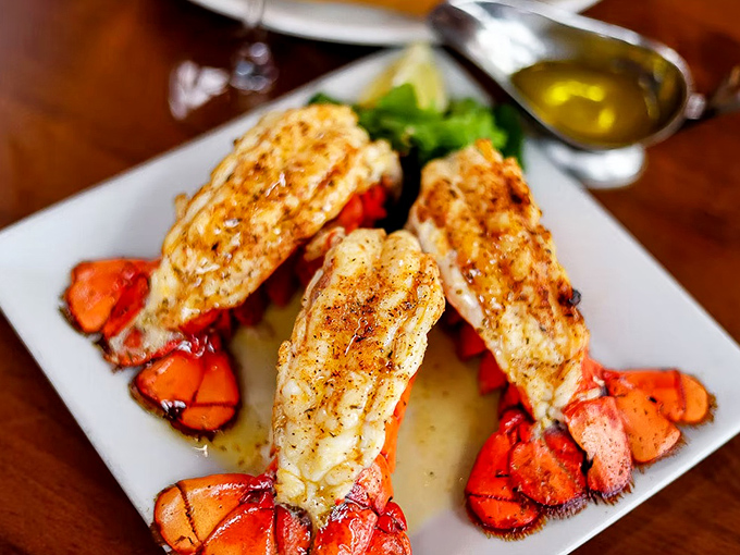 Lobster tails that look like they're auditioning for a seafood calendar &ndash; perfectly split, seasoned, and ready for their butter bath.