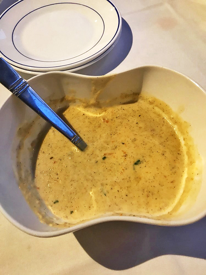 The legendary lobster bisque – creamy, velvety perfection in a bowl. One spoonful and you'll understand why people drive for hours just for this liquid gold.