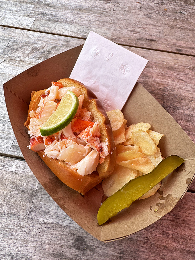Chunks of lobster meat so generous they're practically hanging off the roll. The lime wedge isn't garnish—it's essential architecture.