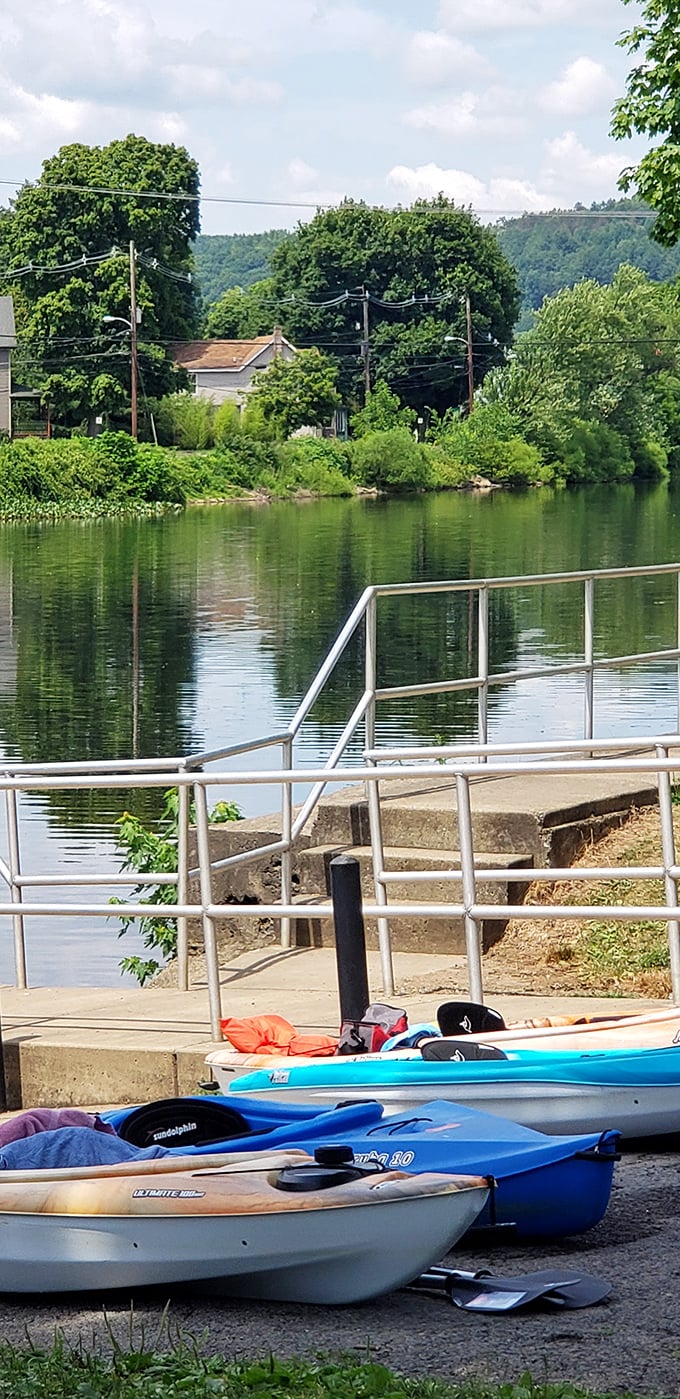 Kayaks await adventure along the riverbank. Nothing says "vacation mode activated" quite like the promise of gentle currents and hidden riverside views.