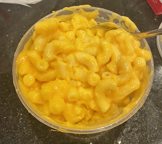 Mac and cheese so gloriously yellow it could guide ships through fog. Comfort food that doesn't just speak to your inner child&mdash;it gives it a warm, cheesy hug.