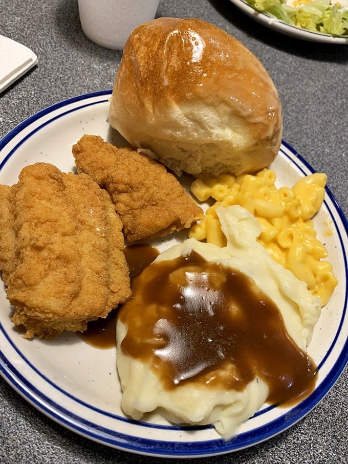 The holy trinity of comfort food: mac and cheese, fried chicken, and mashed potatoes with gravy. Diets come and go, but this plate is eternal. 