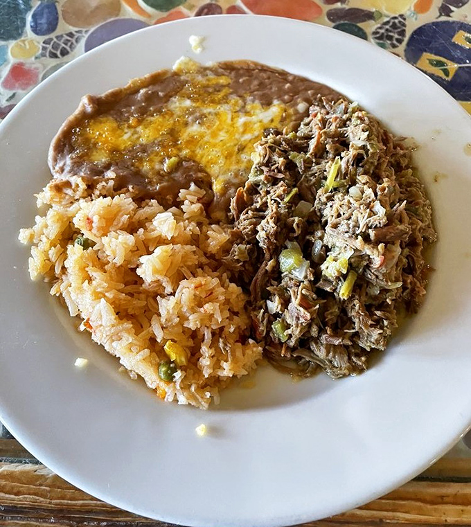 The machaca plate: where tender shredded beef meets perfectly seasoned rice in a romance that puts most rom-coms to shame.
