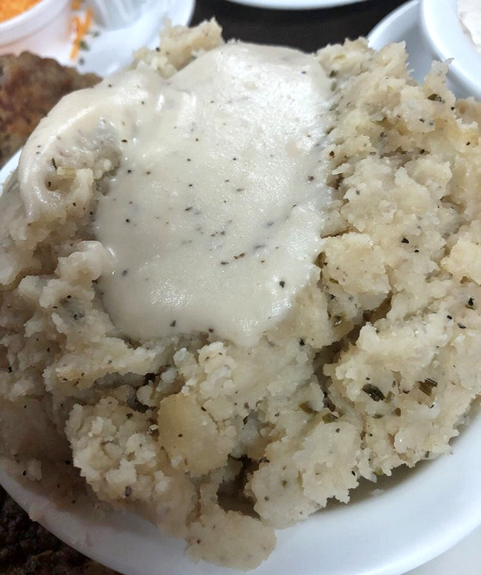 Mashed potatoes so perfectly peppered and buttered, they make you question why anyone bothers with fancy cuisine. Pure comfort in a bowl.