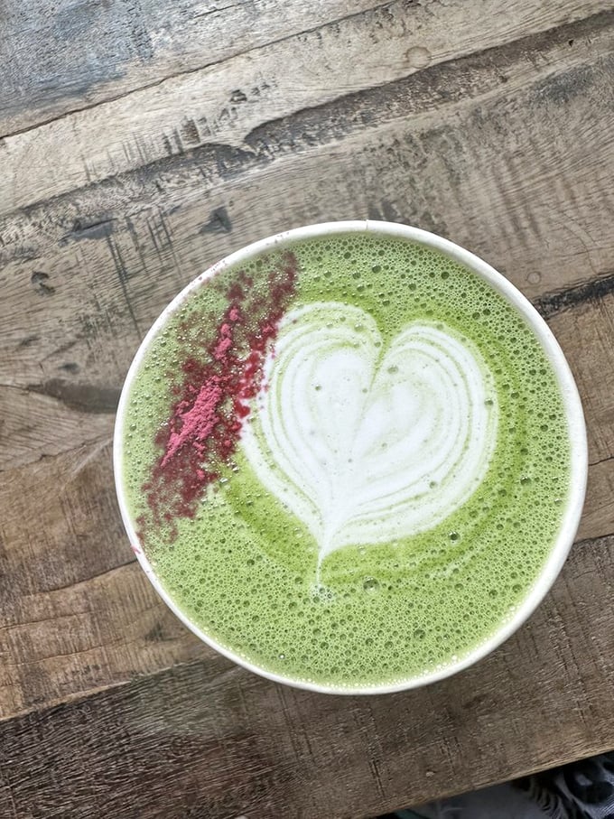 A matcha latte that's dressed for the occasion. That vibrant green canvas with its delicate heart art and pop of pink is like springtime in a cup.