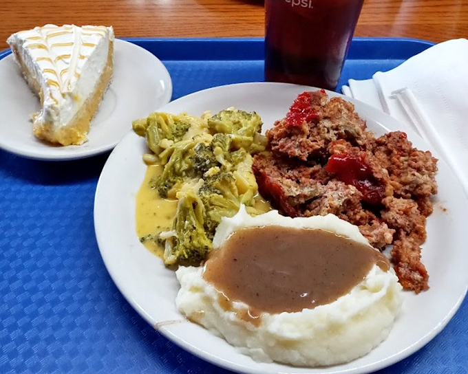 Meatloaf that doesn't apologize for being meatloaf, served with gravy that should be bottled and sold as liquid happiness.