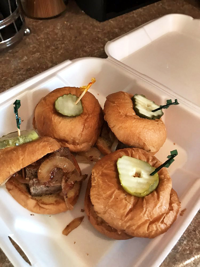 These mini meatloaf sliders with caramelized onions prove that sometimes the best things come in small, pickle-topped packages. 