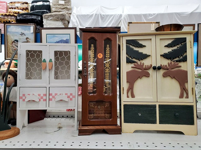 Miniature cabinets with personality to spare. That moose-adorned cupboard isn't just storage&mdash;it's a conversation waiting to happen.