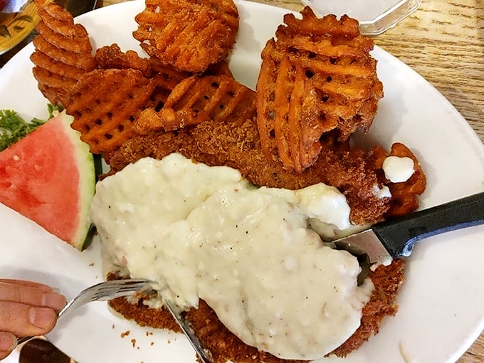 Those waffle fries deserve their own fan club. The golden-brown chicken fried steak with creamy gravy makes dieting seem like a terrible life choice.