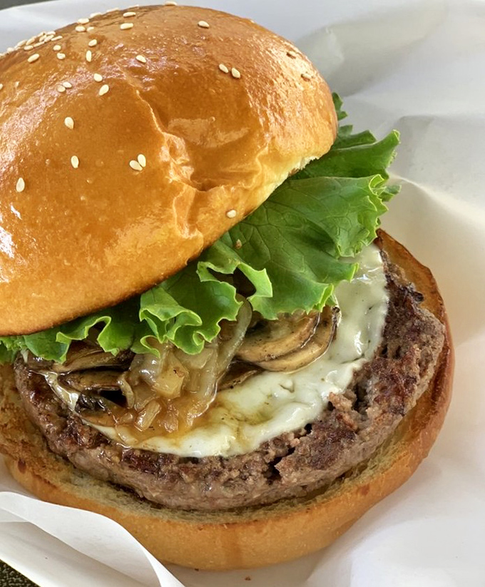 The mushroom Swiss burger: where earthy fungi and creamy cheese transform an already perfect patty into something worth crossing county lines for.