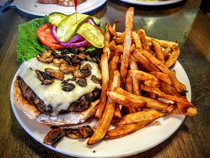 This isn't just a burger&mdash;it's a masterpiece of melted cheese, saut&eacute;ed mushrooms, and beef cooked exactly right, with fries that deserve their own fan club.