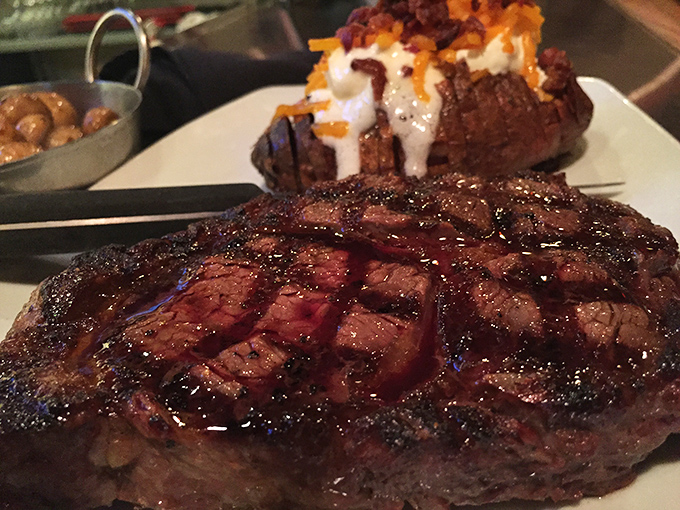 A steak so perfectly seared it could make a vegetarian question their life choices, glistening with just enough sauce to enhance without overwhelming.