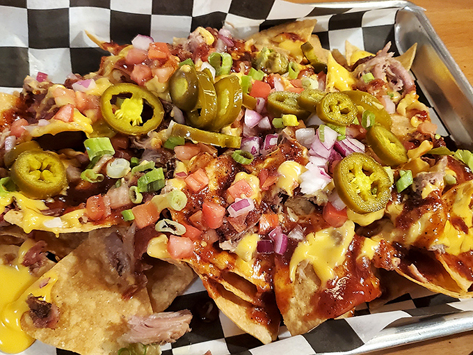 BBQ nachos that defy gravity and good manners. The jalape&ntilde;os aren't just garnish&mdash;they're little green flavor grenades waiting to detonate on your taste buds.