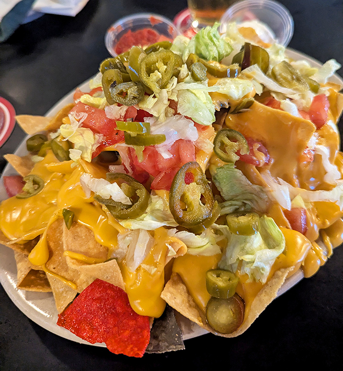 These nachos aren't just a appetizer&mdash;they're an architectural marvel of cheese, jalape&ntilde;os, and toppings that requires strategic planning to conquer.