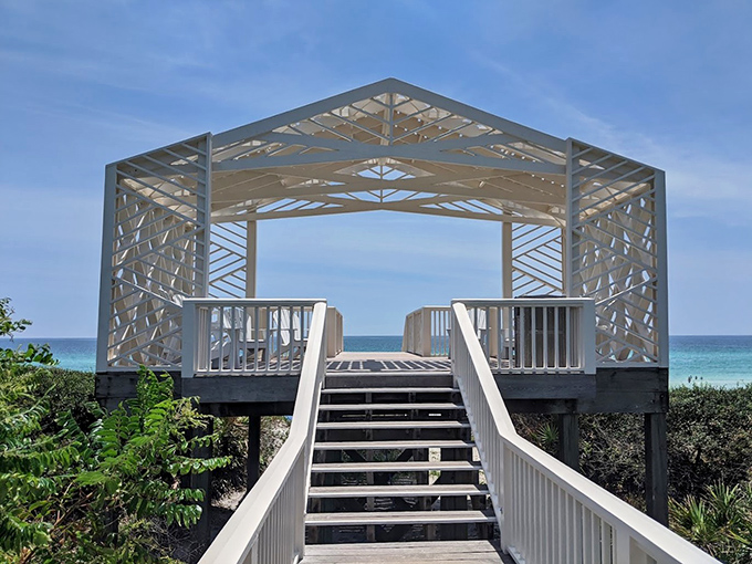 This geometric beach pavilion looks like it was designed by an architect who couldn't decide between "coastal chic" and "modern art installation." Either way, it frames the Gulf perfectly.