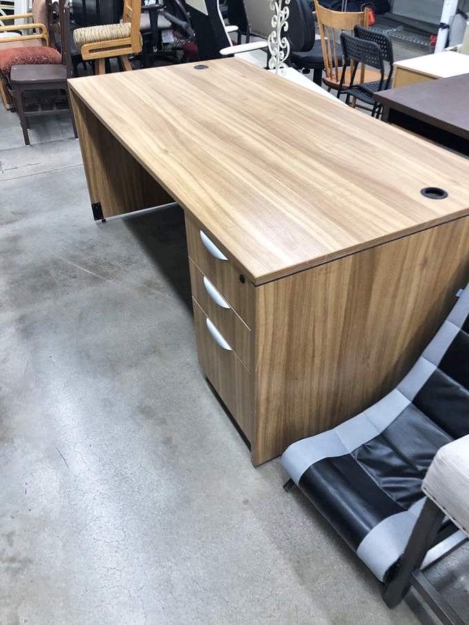 This desk isn't just furniture; it's someone's future home office command center waiting to witness its next great American novel.