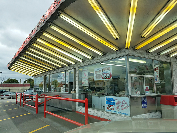 Classic drive-up architecture meets modern appetites in this timeless custard stand design perfection.