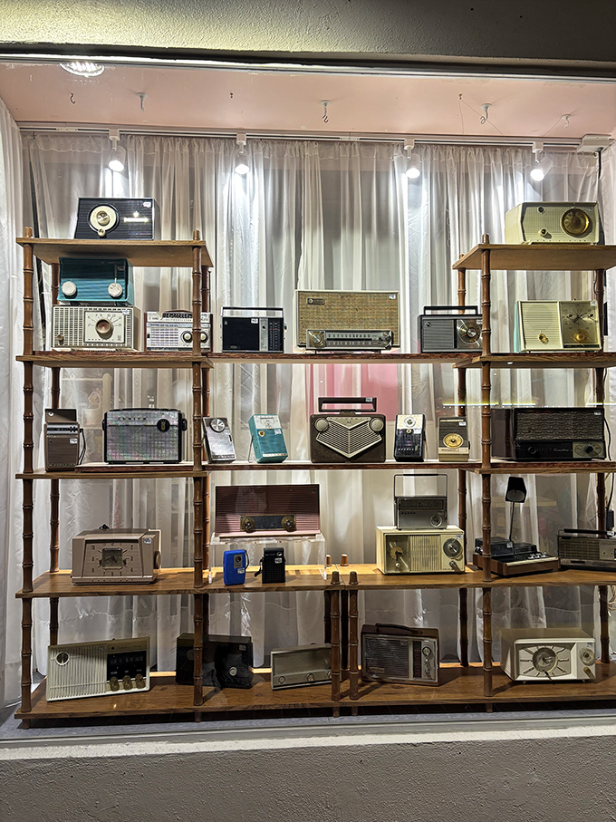 A symphony of vintage radios stands ready to broadcast from another era. Tune in to nostalgia, no subscription required.