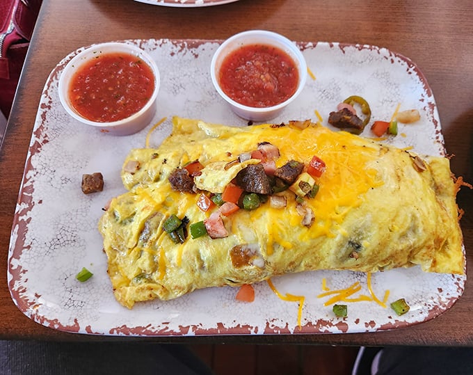 This omelet doesn't just contain ingredients; it showcases them like proud Texan parents at a high school graduation.