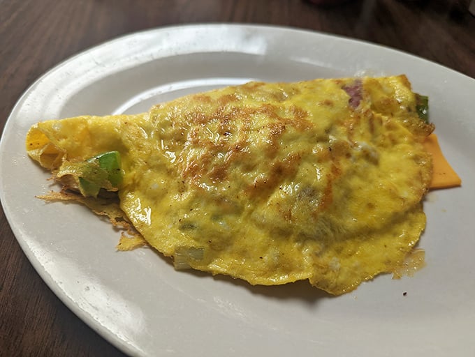 An omelet shouldn't just feed you&mdash;it should hug you from the inside. This cheese-draped beauty does exactly that, with peppers peeking out like welcome surprises.