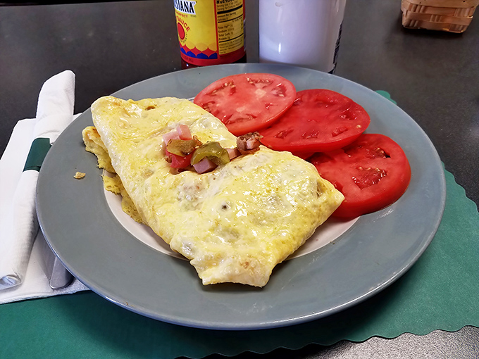 This omelet arrives stuffed fuller than your uncle's wallet before the grandkids visit for the holidays.