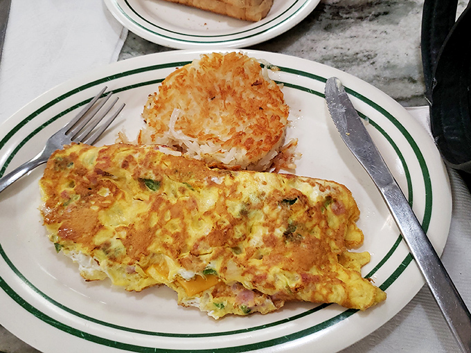 This isn't just an omelet &ndash; it's a masterclass in breakfast architecture, with perfectly browned edges and a fluffy interior.