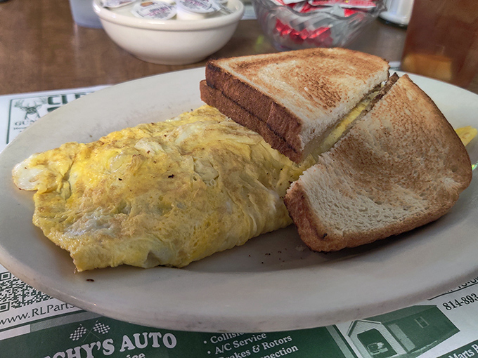 This isn't just an omelet&mdash;it's a golden-hued masterpiece of morning potential, paired with toast that's achieved that ideal shade of brown.