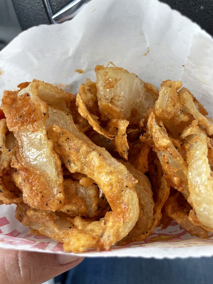 These aren't your average onion rings&mdash;they're golden halos of crispy perfection that make you wonder why anyone bothers with jewelry when these exist. 