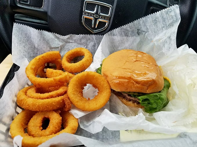 These aren't just onion rings and a burger&mdash;they're edible gold medals for surviving another workweek. Worth every delicious calorie.