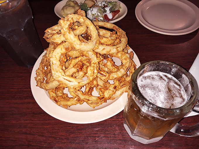 These onion rings aren't just a side dish; they're golden halos of crispy perfection that deserve their own fan club.