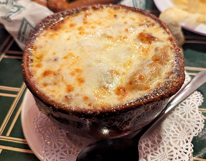 French onion soup that's achieved the perfect cheese-pull-to-broth ratio – the culinary equivalent of hitting the lottery on a cold Erie day.