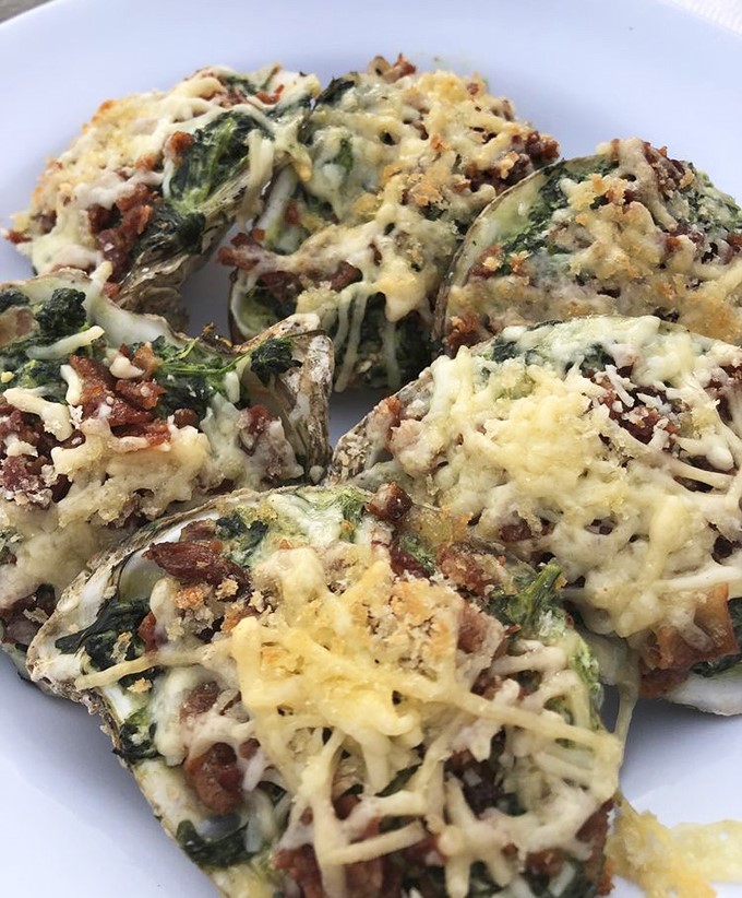 These Oysters Rockefeller are dressed better than most people at the Oscars, with spinach, bacon, and cheese creating a decadent masterpiece.