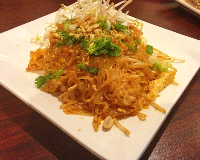 Pad Thai done right is culinary poetry &ndash; these noodles, topped with crushed peanuts and fresh herbs, tell a delicious story with every bite.