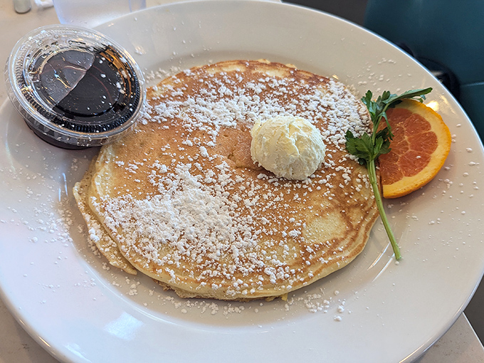 This pancake doesn't just arrive at your table&mdash;it makes an entrance. Dusted with powdered sugar and topped with butter that melts like your resolve.