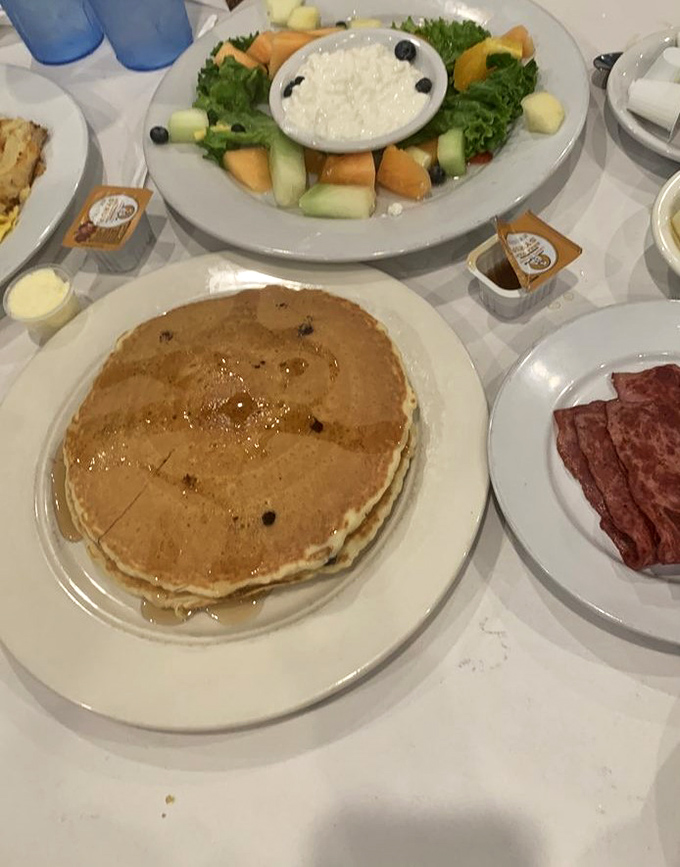 Golden pancakes that could double as edible frisbees share table space with fresh fruit &ndash; breakfast nirvana has been achieved.