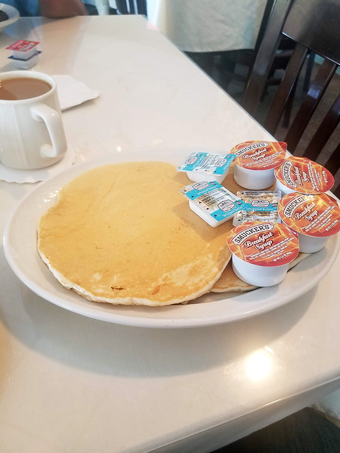 A pancake so perfectly golden it belongs in the breakfast hall of fame, with enough syrup options to satisfy even the most dedicated sweet tooth. 