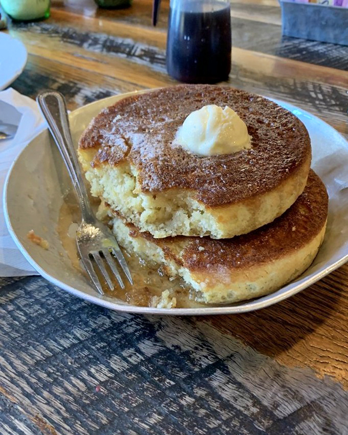 These aren't just pancakes; they're edible gold medals for making it to Gatlinburg. That butter pat on top? The champion's trophy.