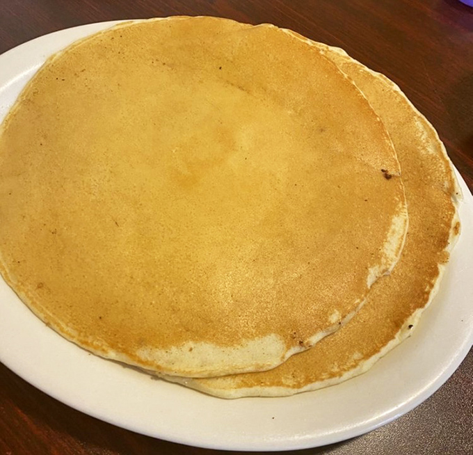 Pancakes so perfectly golden they could win medals. The kind that make you wonder if your grandmother secretly moonlights in the kitchen.