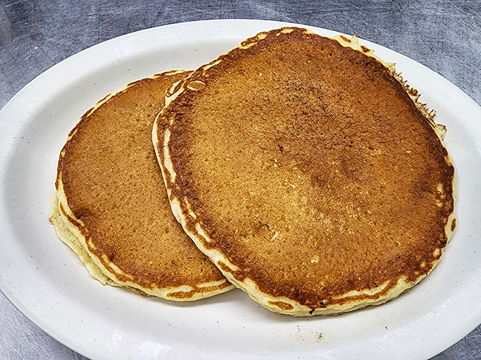 Pancakes the size of frisbees with that perfect golden hue. No artisanal maple-infused foam needed &ndash; just pure breakfast bliss.