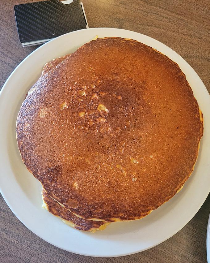 This pancake isn't just big&mdash;it's practically a frisbee of deliciousness that hangs over the plate edges, daring you to finish it all.