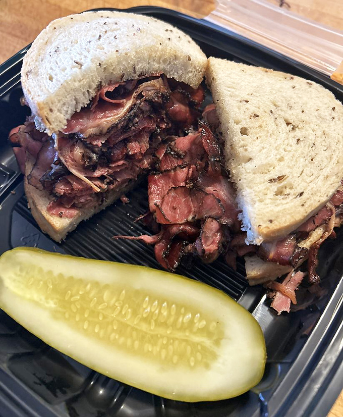 This pastrami sandwich isn't just lunch; it's a religious experience. The meat-to-bread ratio would make Solomon himself nod in approval.