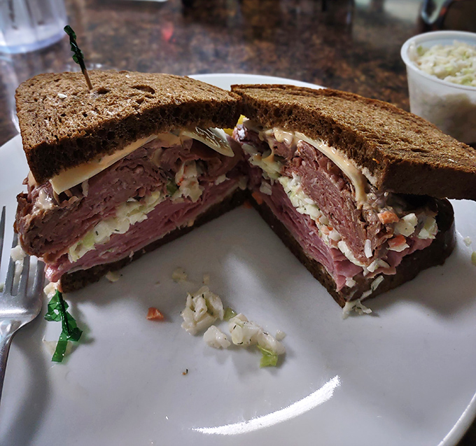 This isn't just a sandwich; it's a skyscraper of pastrami architecture that would make New York delis slow-clap in respect.