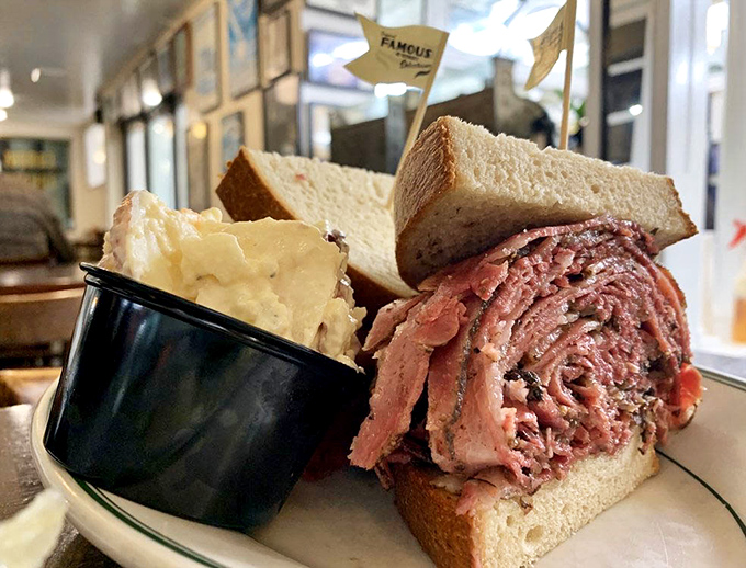 Mountains of pastrami piled high enough to require structural engineering consultation before attempting that first glorious bite.