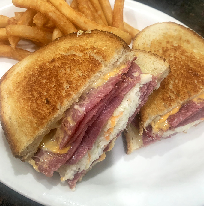 A perfectly executed diner sandwich that would make Don Draper weep with joy. Crispy, gooey, meaty perfection between two slices of golden toast.