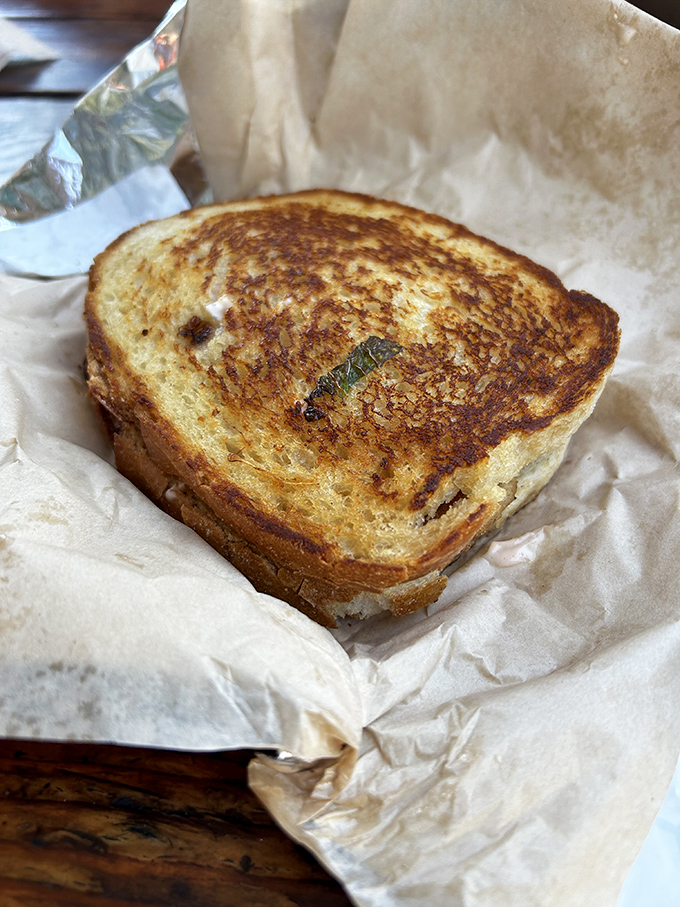 The humble grilled cheese, elevated to art form. That golden-brown crust is what childhood memories are made of, only better because you're an adult now.