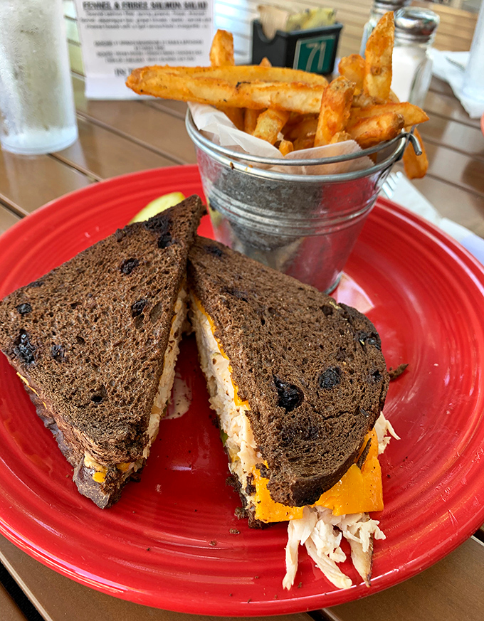 Golden fries standing at attention in their metal bucket, flanking a patty melt that's achieved that perfect crisp-to-melt ratio.