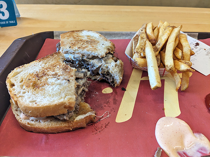 The humble patty melt gets its glamour shot alongside hand-cut fries. This is the sandwich your childhood grilled cheese wishes it grew up to be.