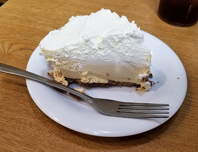 Cream pie so light it practically hovers above the plate, with a graham cracker crust playing the perfect supporting role to its cloud-like filling.