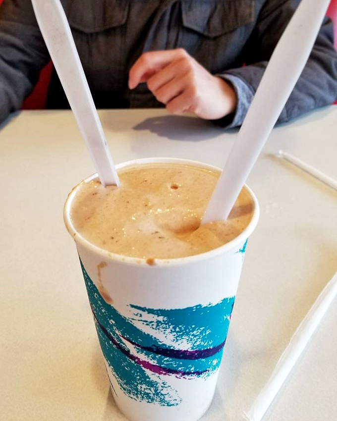 Two straws, one shake&mdash;either a romantic gesture or a tactical advantage. This peanut butter masterpiece demands serious sipping strategy.